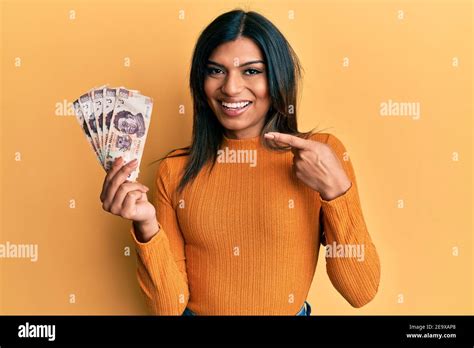 Young Latin Transsexual Transgender Woman Holding 500 Mexican Pesos