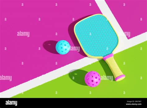 Pickleball Racket And Sports Balls On The Court 3d Rendering Stock