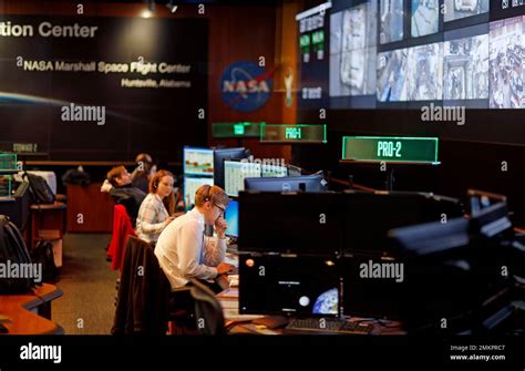 Workers Monitor Research Operations Aboard The International Space