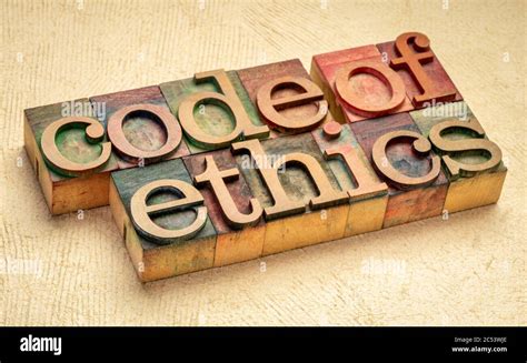 Code Of Ethics Word Abstract In Letterpress Wood Type Printing Blocks Stained By Color Inks