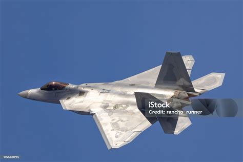Close Side View Of A F22 Raptor In Beautiful Light With Afterburners On
