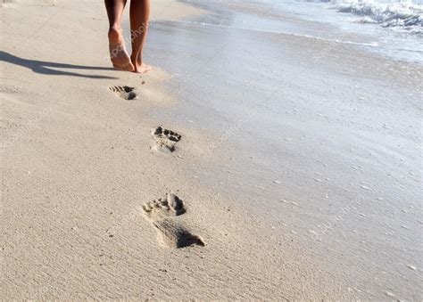 Footprints In The Sand On The Beach