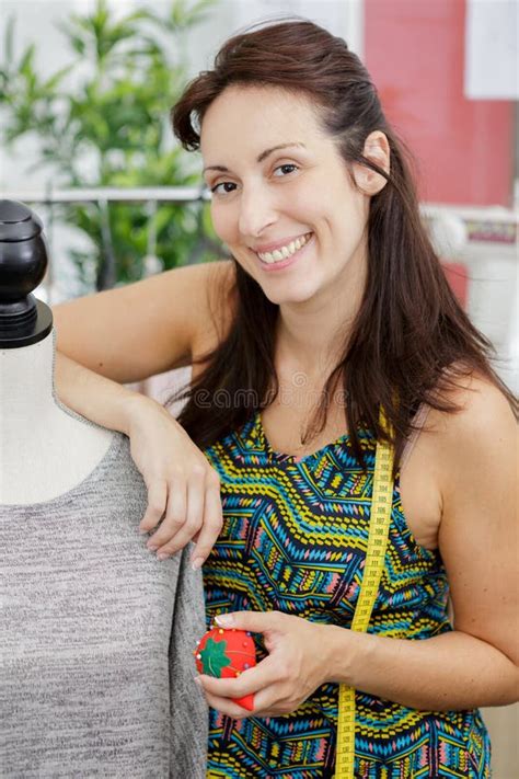 Portrait Female Fashion Designer Holding Pin Cushion Stock Image
