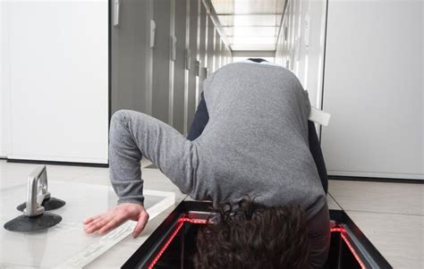 Premium Photo Young It Engineer Connecting Cables In Server Room At Modern Data Center