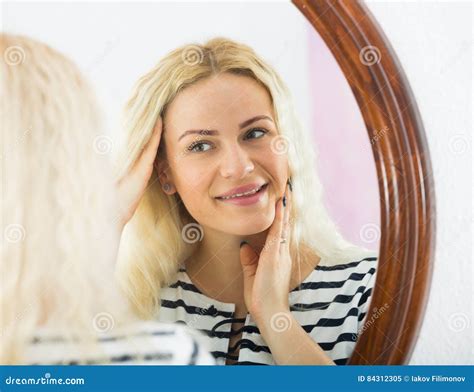 Cute Girl Watching Herself In Mirror Indoors Stock Image Image Of