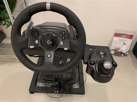 Logitech Steering Wheel Gear Shifter And Pedal Set Attached To A Next Level Stand Video