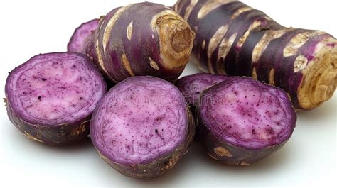 Purple Starchy Taro Root Close Up With Cut Pieces Exposing The Flesh