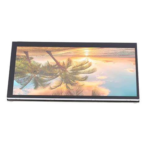 A Laptop Computer Sitting On Top Of A White Table Next To A Palm Tree And Ocean