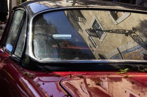 Premium Photo Reflection Of Building On Car