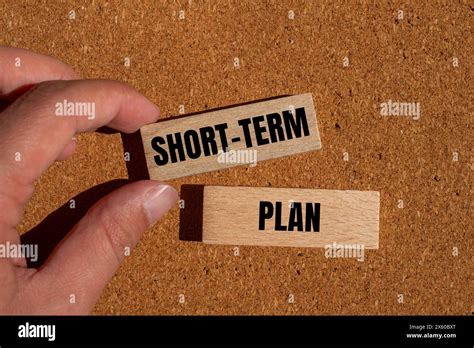Short Term Plan Words Written On Wooden Blocks With Brown Background