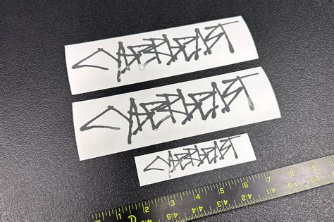 custom plotted text in tesla cybertruck graffiti font vinyl wrap emb t sportline tesla