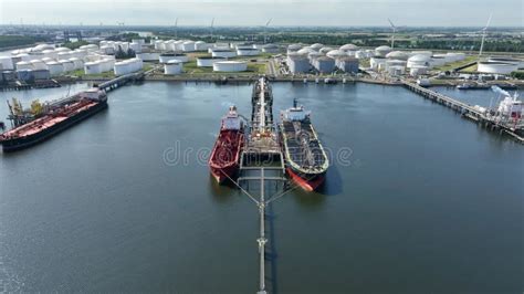 Crude Oil Tanker Ships Unloading Petrochemicals To A Shore Fuel Depot Stock Footage Video Of