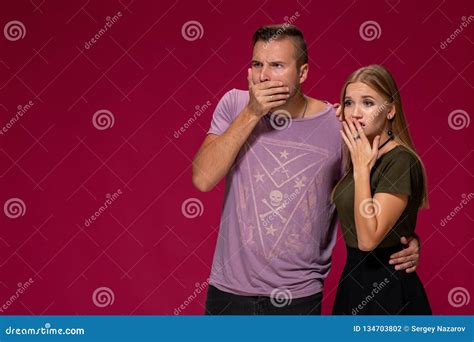 Unhappy Discontent Woman And Man Look With Disgusting Expression As