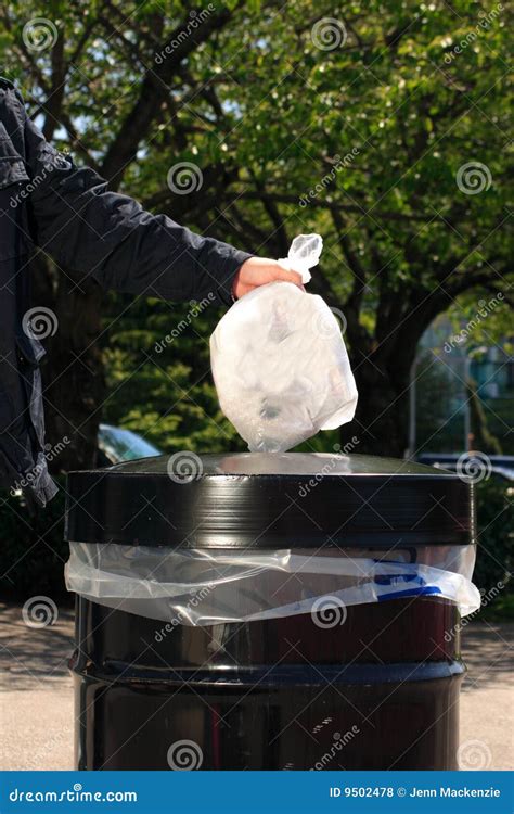 Man Putting Garbage In A Can Stock Photo Image Of Garbage White