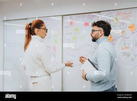 Collaborative Brainstorming Session In A Corporate Office With Business