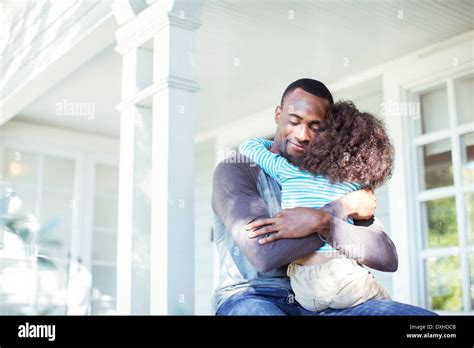 Father And Teen Daughter Hugging