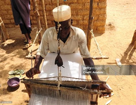 A Nigerian Worker Makes A Traditional Fabric Weaving Known As Sakar