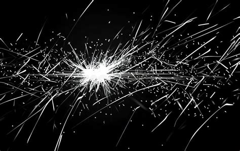 Dynamic Sparks Flying In A Dark Environment During A Metalworking Process At A Workshop In The