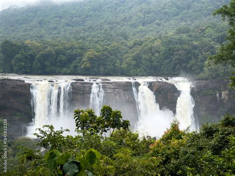 Athirappilly Falls In Thrissur District Kerala Cascading Through Lush