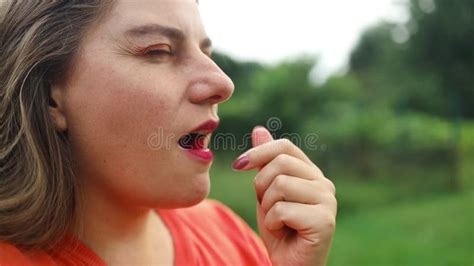 Close Up Of Red Female Lips With Raspberry Beautiful Female Model Lips Eating Raspberry Pink