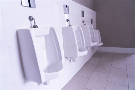 Public Restroom Row Of Urinals The Urinal Design Is White Ceramic