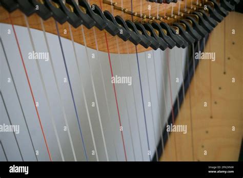 Closeup Shot Of The Strings Of A Wooden Harp Stock Photo Alamy
