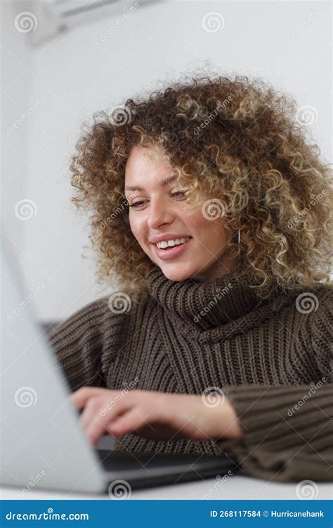 Cheerful Young Woman Typing Code On Laptop Computer At Home Female
