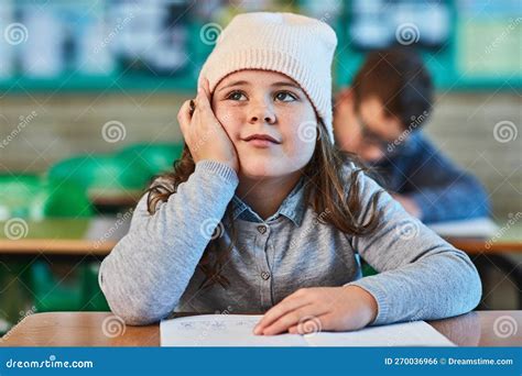 Daydreaming In Class An Elementary School Girl Daydreaming In The Classroom Stock Photo