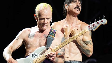 Download Red Hot Chili Peppers Flea Performing Shirtless Wallpaper