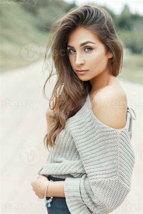 Young Pretty Woman With Curly Hairstyle In Vintage Knitted Sweater With