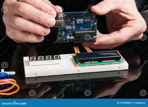 Arduino UNO Board With Electronic Components Editorial Photography Image Of Hands Development
