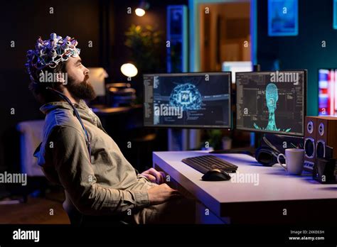 computer engineer wearing eeg headset on head to communicate with artificial intelligence entity