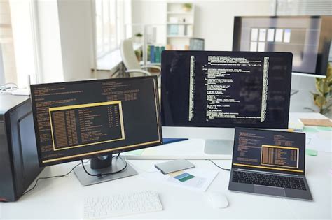 premium photo background image of several computer screens with code lines on desk in it
