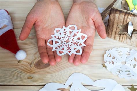 A Snowflake Made From Paper With Your Own Hands Gracefully Decorates A Winter Interior Adding