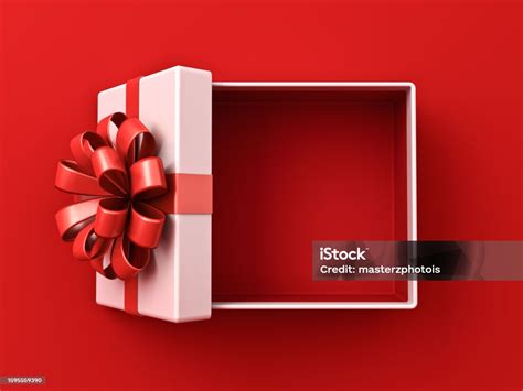 빈 흰색 선물 상자 열기 또는 그림자 최소한의 개념적 3d 렌더링과 함께 짙은 빨간색 배경에 격리된 빨간색 리본 활로 묶인 흰색 선물 상자의 위쪽 보기 상자에 대한 스톡