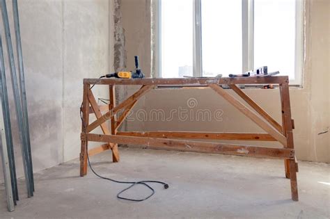 Wooden Scaffolding Stand At The Window In A Large Empty Room Repair
