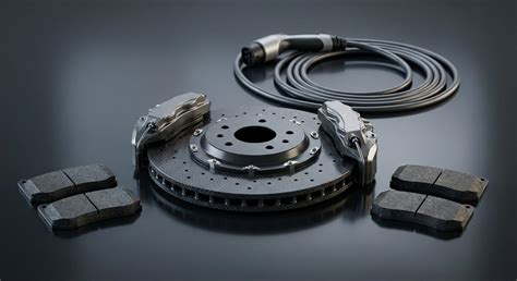 Carbon Ceramic Brake Pads And Rotor Next To An Ev Charging Cable On A
