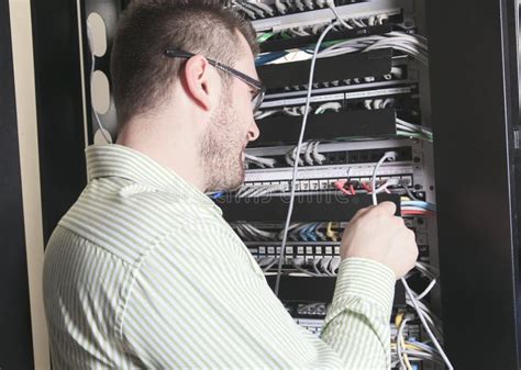 Network Engineer Working In Server Room Stock Image Image Of