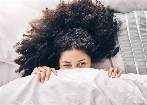 Premium Photo Bed Wink Portrait And Black Woman In The Morning After
