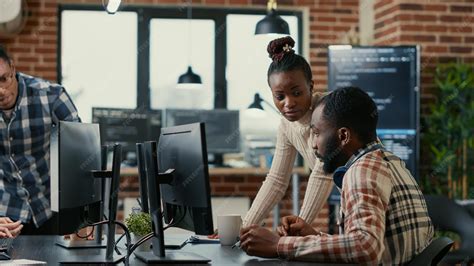 Premium Photo Mixed Team Of Programmers Brainstorming Ideas For New Cloud Computing User