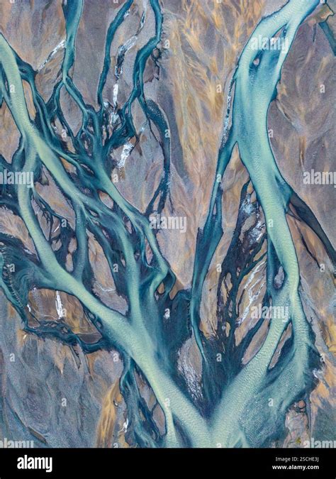 Aerial Shot Showcasing The Intricate Patterns And Stunning Colors Of River Deltas Along The