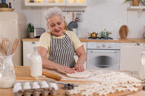 Happy Senior Woman Cooking In Kitchen Stylish Older Mature Gray Haired