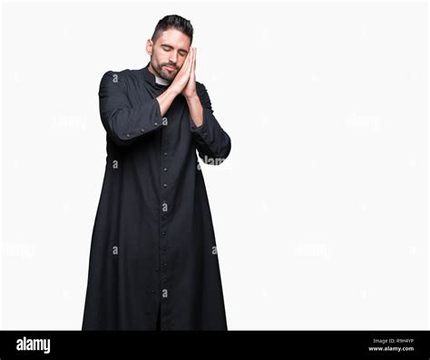 Young Christian Priest Over Isolated Background Sleeping Tired Dreaming