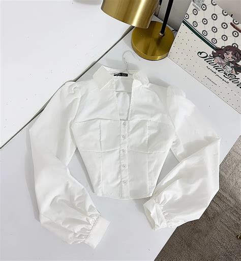 ‎olivia Store For Tops متجر توب اوليفيا‎ ‎قميص ابيض مخصر متوفر 🤍