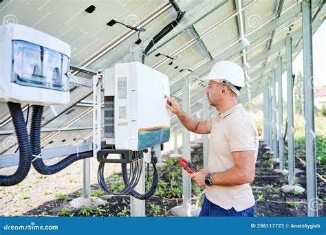 Professional Worker Checking Voltage On Solar Inverter Stock Image Image Of Installation