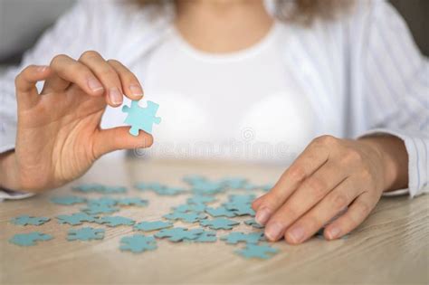 Business Woman Hands Assembling Puzzle Details Concept Of Finding