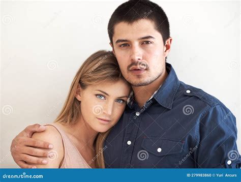 Theyre A Strong Young Couple Smiling Young Man With His Arm Around His