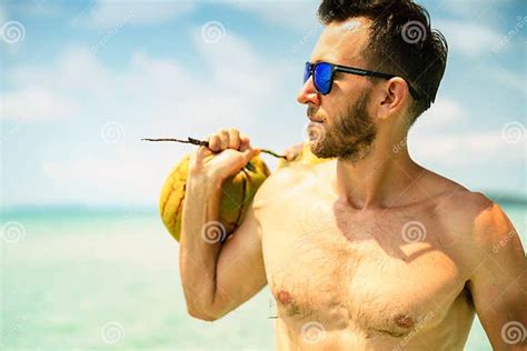 Portrait Of An Attractive Young Man On A Tropical Beach Stock Image