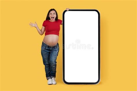 Great Promo Amazed Young Pregnant Woman Standing Near Big Blank