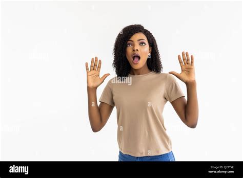 Afro American Young Woman Looking Down Surprised With Something